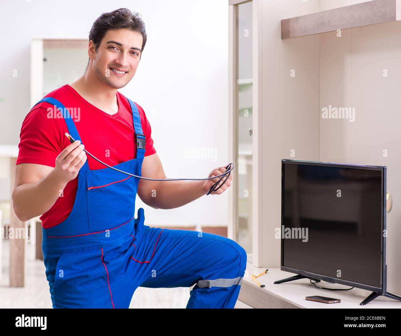 The professional repair engineer repairing broken tv Stock Photo - Alamy