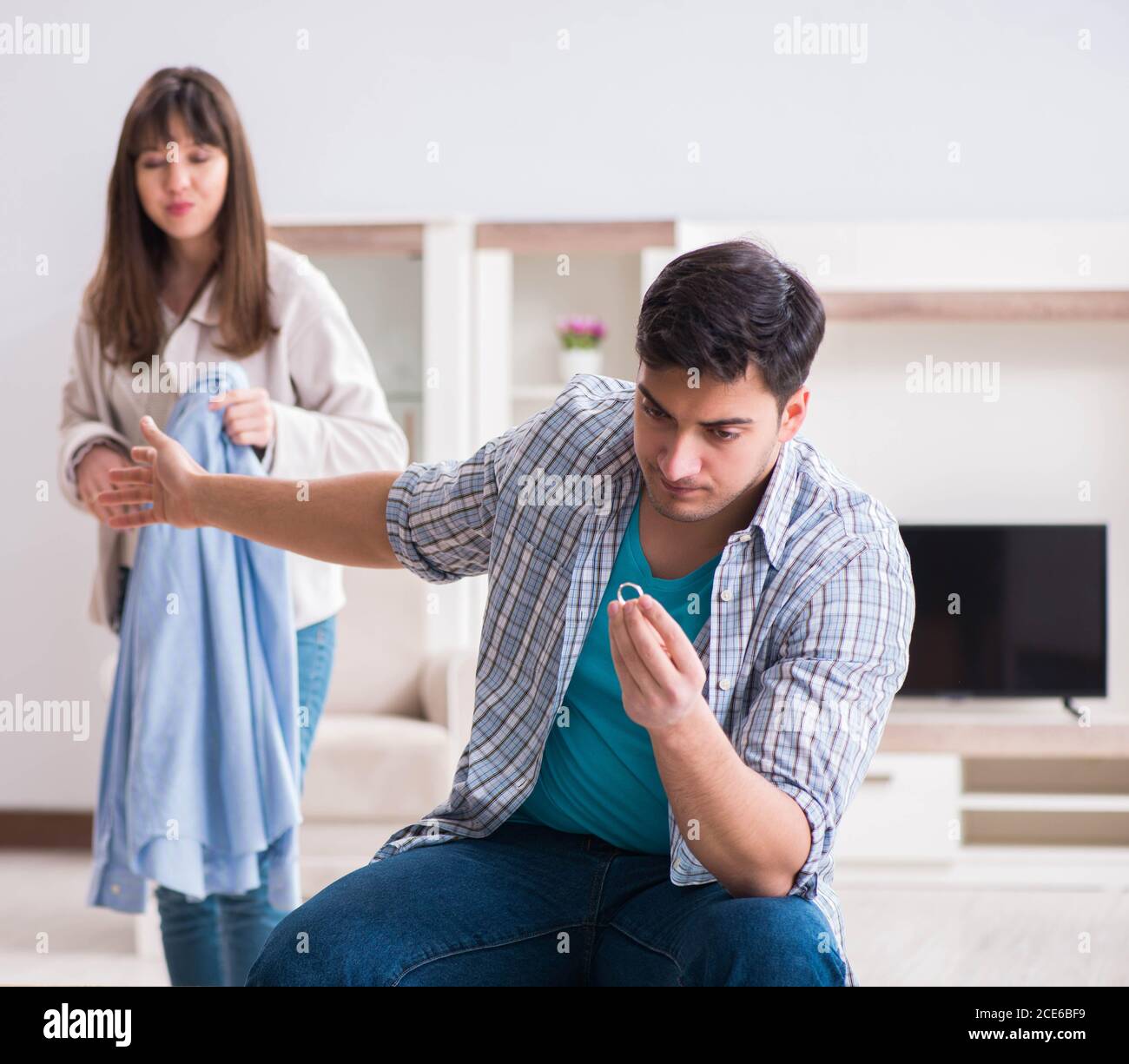 The woman evicting man from house during family conflict Stock Photo ...