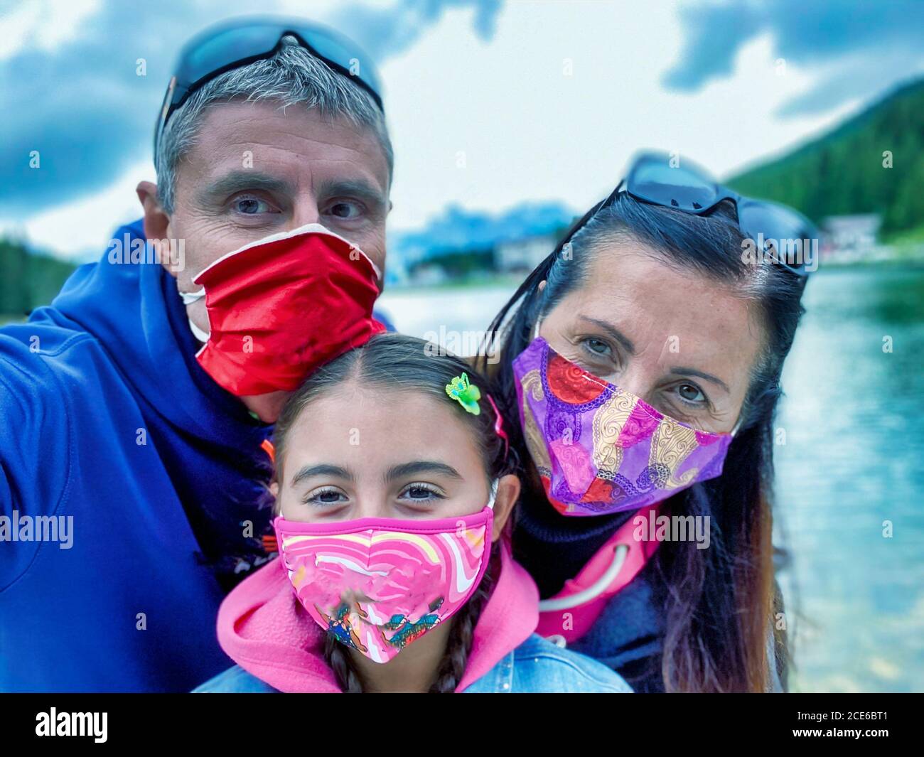 Happy couple with their daughter happy during a mountain excursion ...