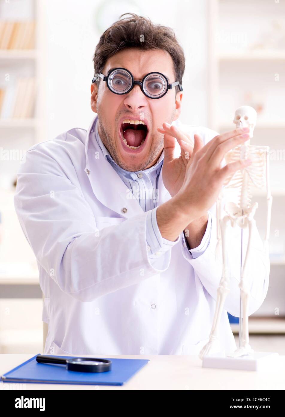 The crazy doctor studying human skeleton Stock Photo - Alamy