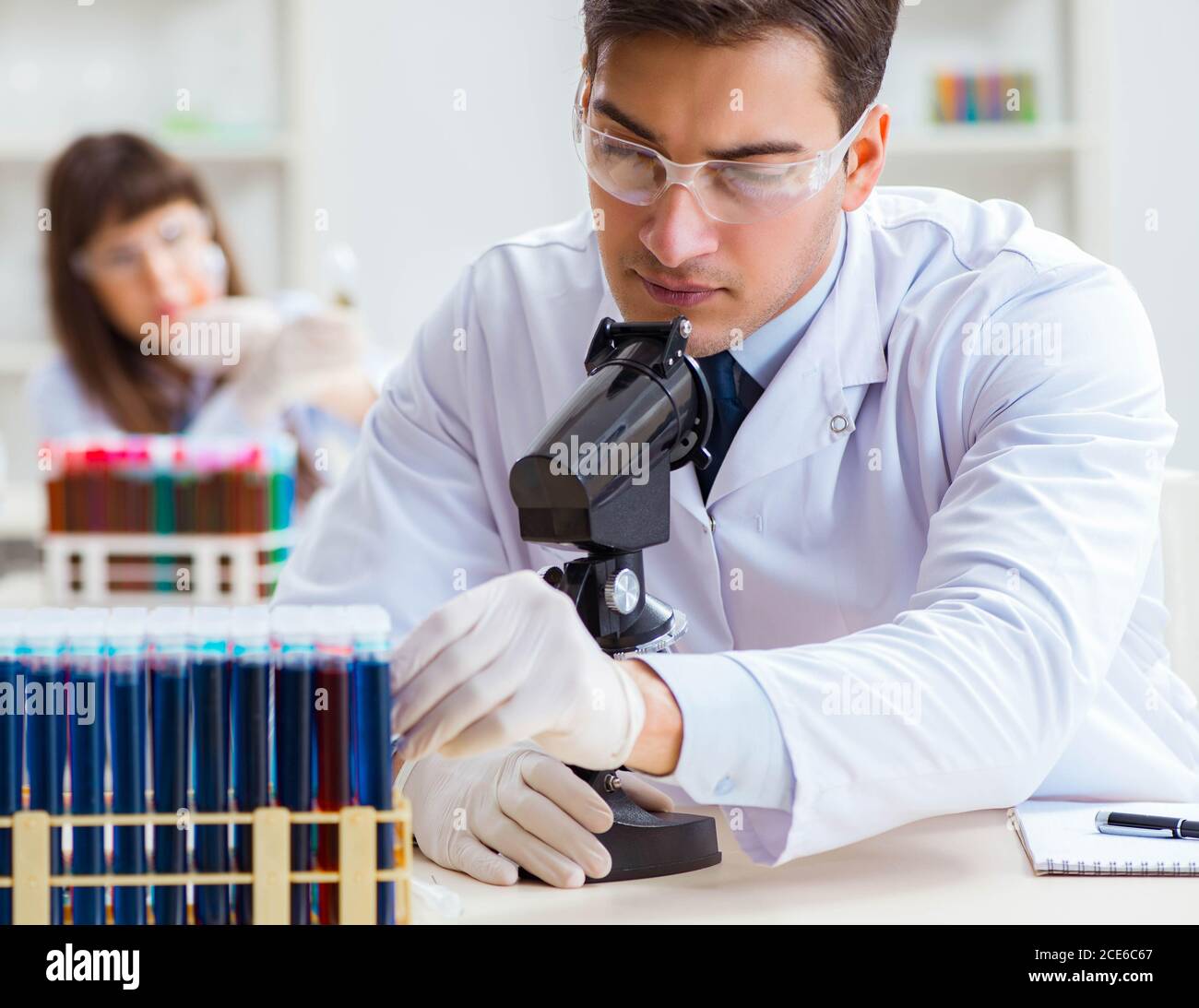 The two chemists working in lab experimenting Stock Photo - Alamy