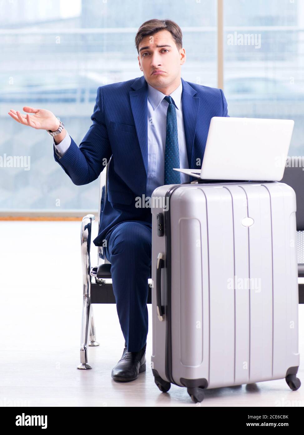 Businessman waiting at the airport for his plane in business class Stock Photo - Alamy
