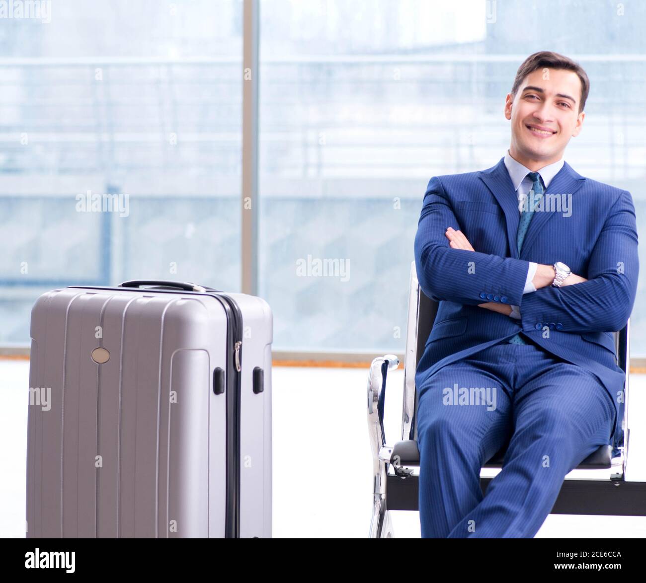 Businessman waiting at the airport for his plane in business class Stock Photo - Alamy