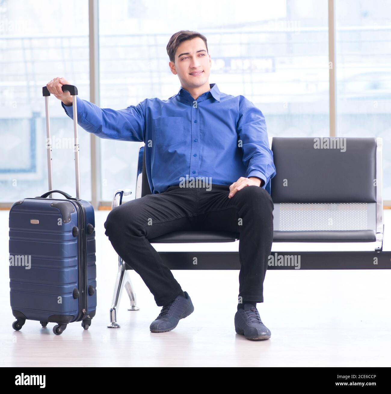 The man wairing to boarding in airport lounge room Stock Photo - Alamy