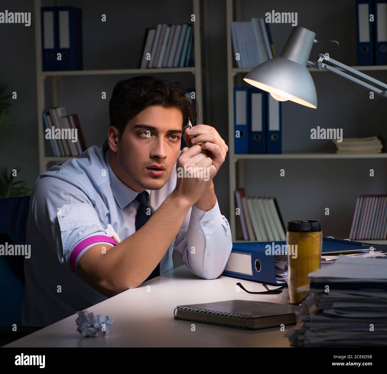 The employee relieving stress from overtime with drugs narcotics Stock ...