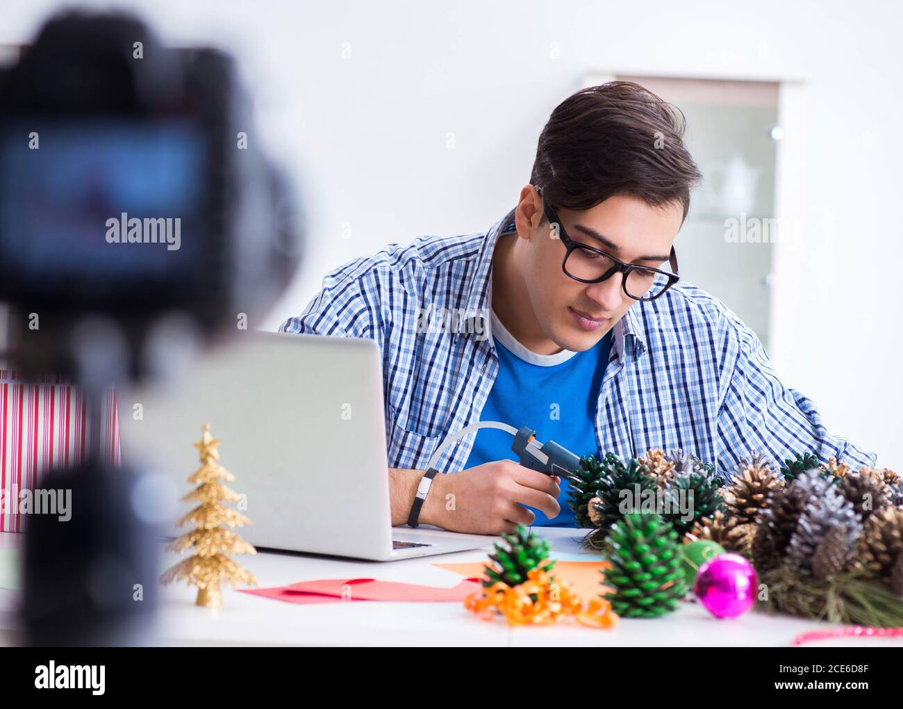 The young vlogger recording video doing christmas decoration Stock ...