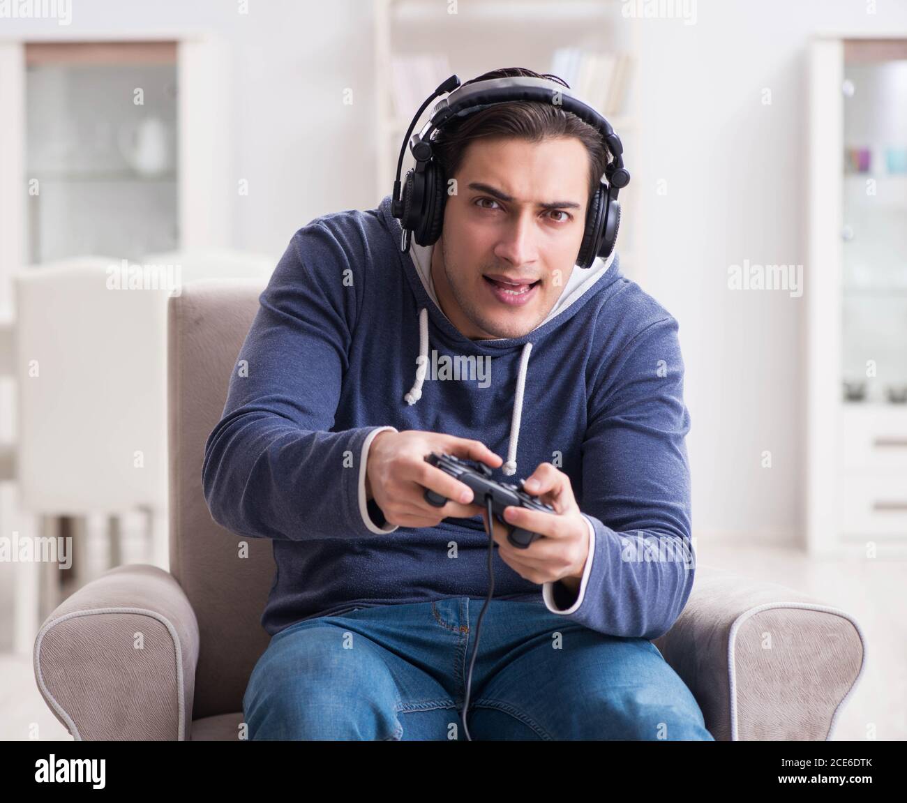 The young man playing computer games at home Stock Photo - Alamy
