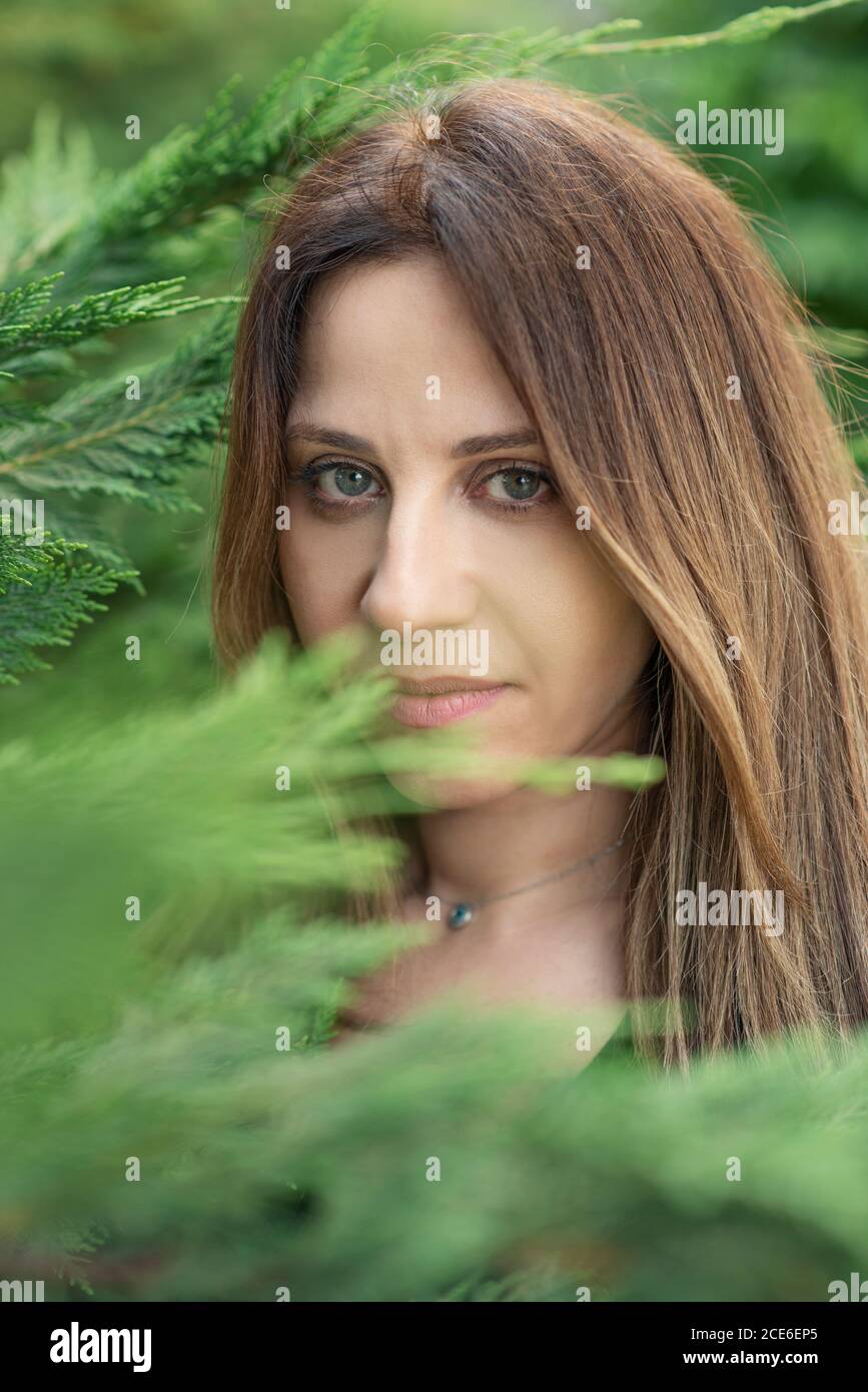 Woman standing in nature hi-res stock photography and images - Alamy