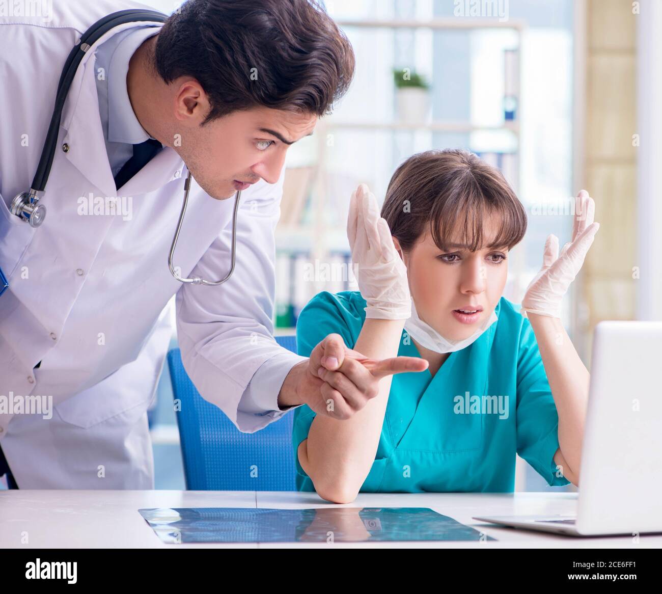The doctor angry at his assistant due to medical error Stock Photo - Alamy