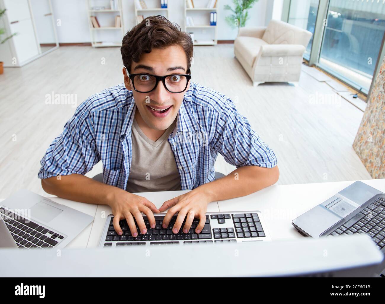 The young trader monitoring markets on screens Stock Photo - Alamy