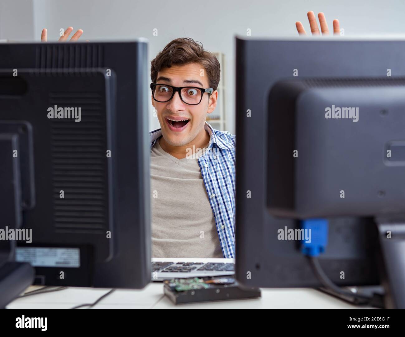 The young trader monitoring markets on screens Stock Photo - Alamy