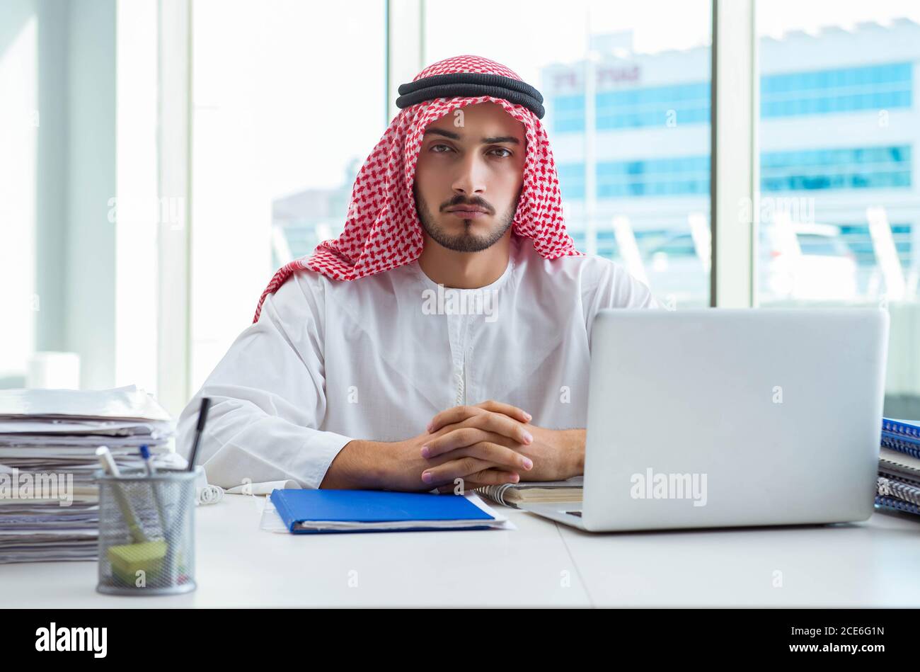 The arab businessman working in the office Stock Photo - Alamy