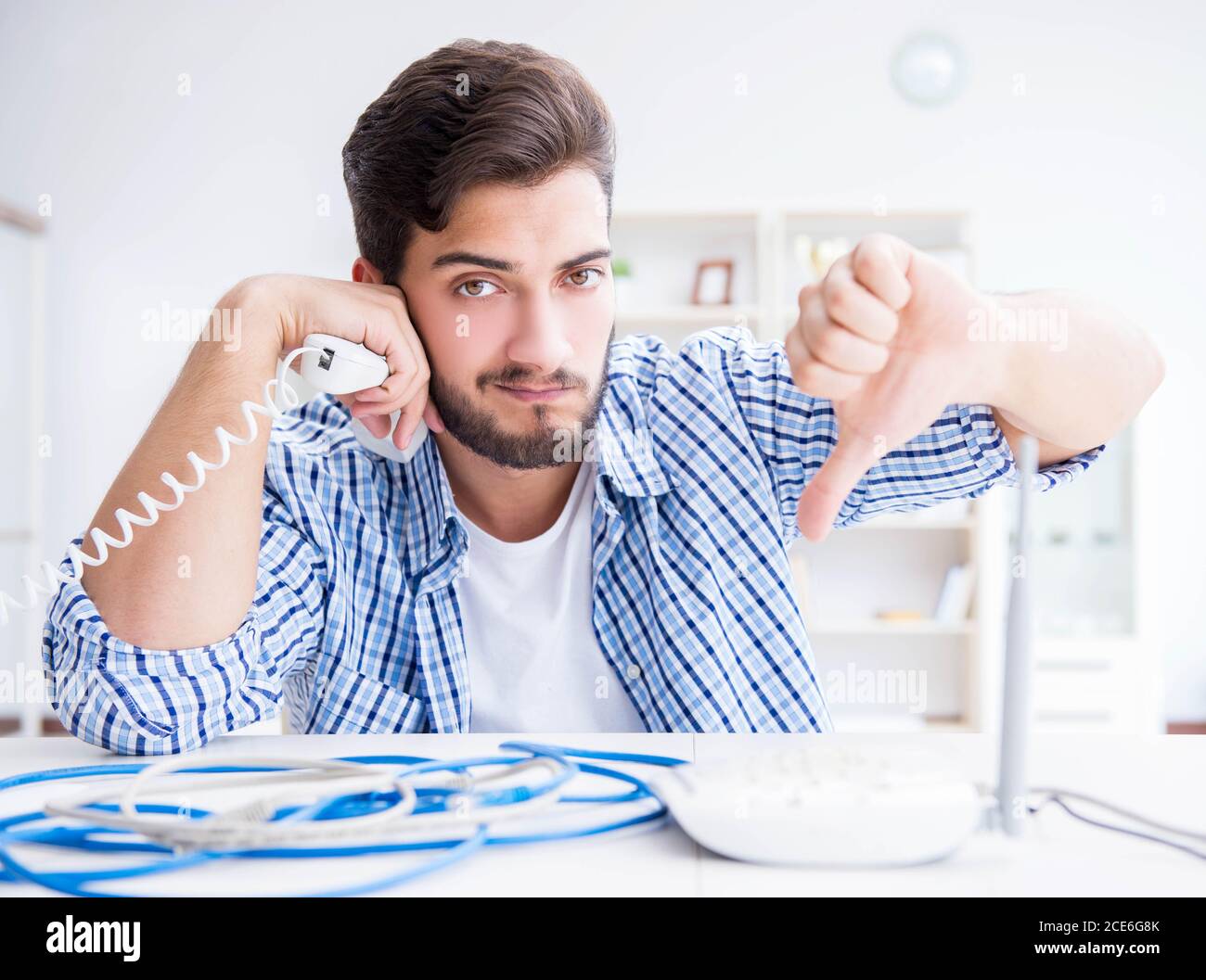 The frustrated young man due to weak internet reception Stock Photo - Alamy