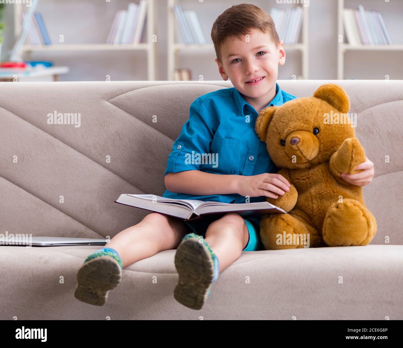 The small boy reading books at home Stock Photo - Alamy
