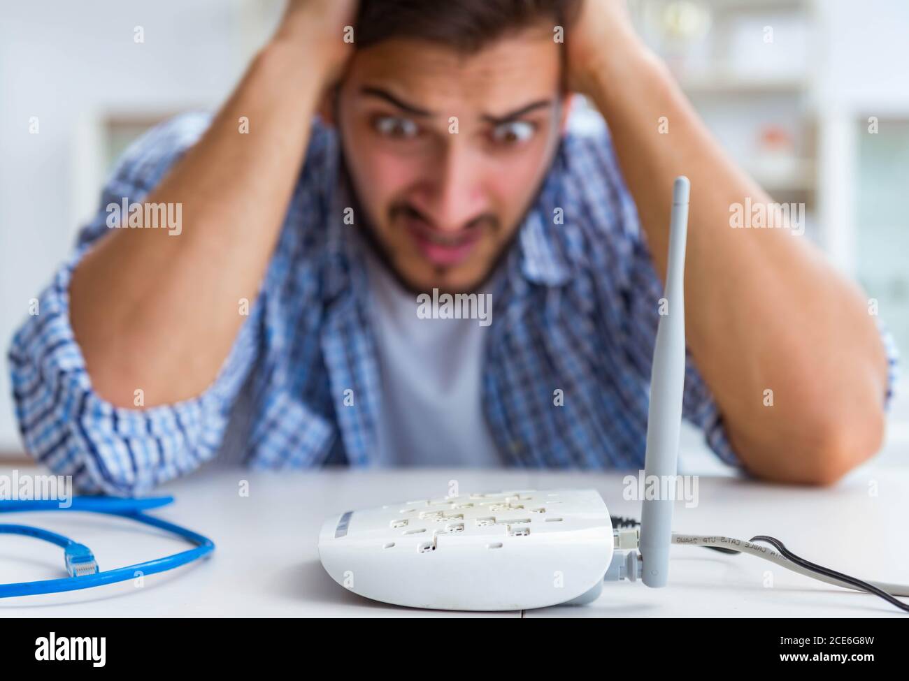 The frustrated young man due to weak internet reception Stock Photo - Alamy