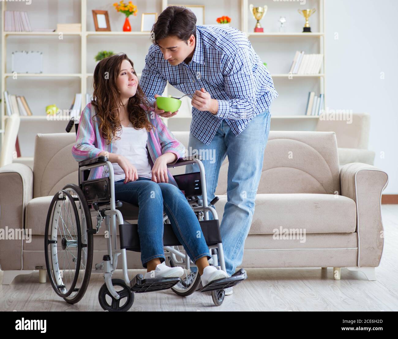 The young family taking care of each other Stock Photo - Alamy