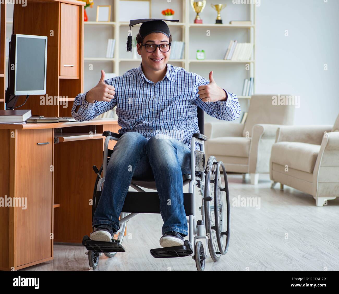 The disabled student studying at home on wheelchair Stock Photo - Alamy