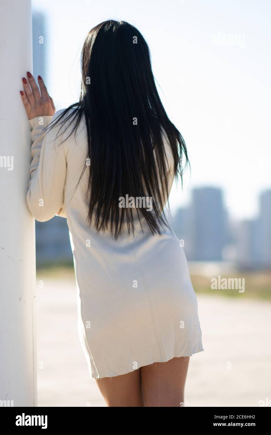 Rear view young hispanic woman hi-res stock photography and images - Alamy