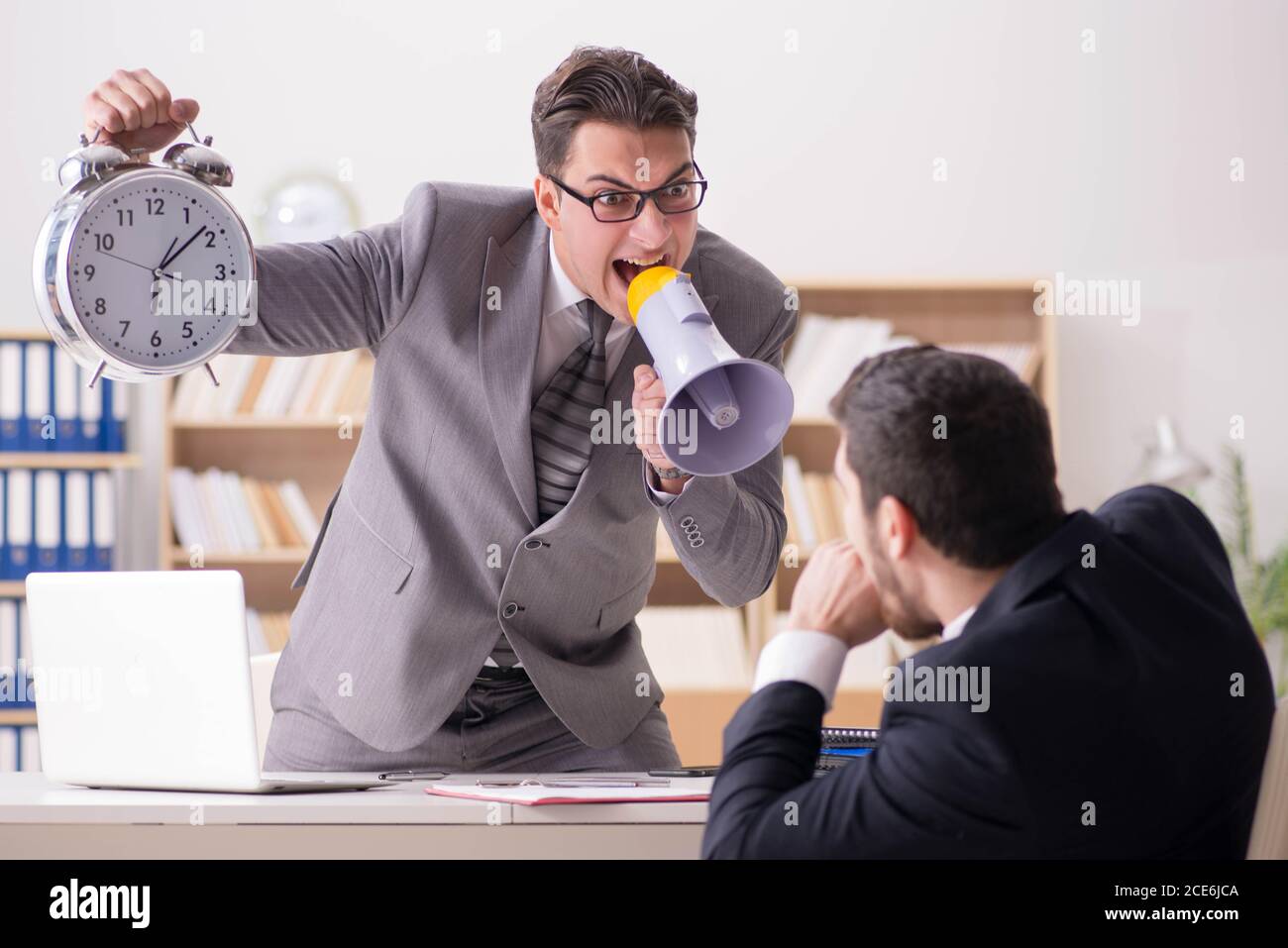 The angry boss shouting at his employee Stock Photo - Alamy