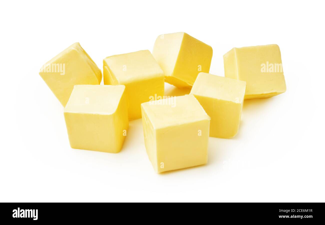 Pieces of butter isolated on white background. Butter cubes Stock Photo ...