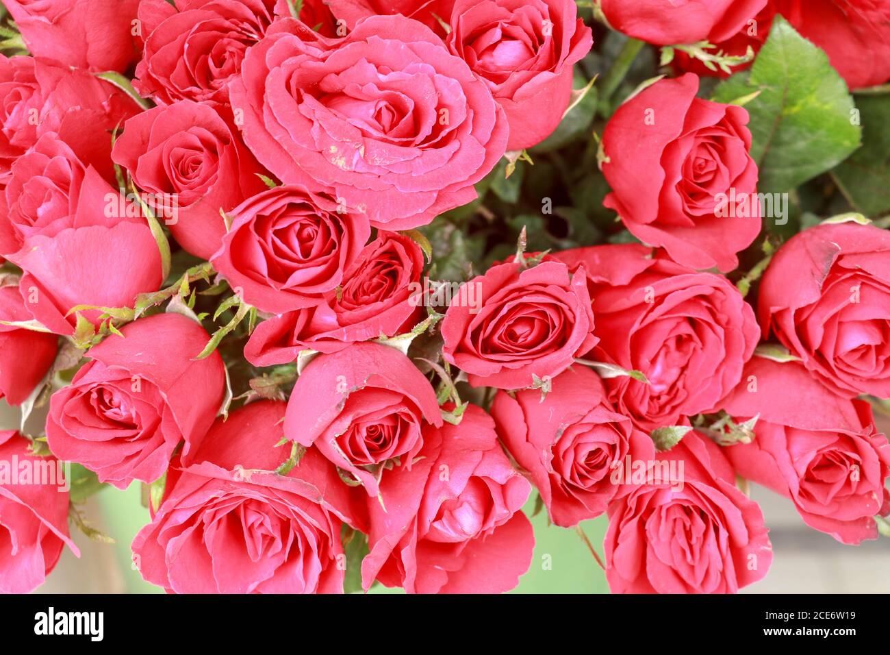 Red rose bouquet background in grocery store Stock Photo - Alamy