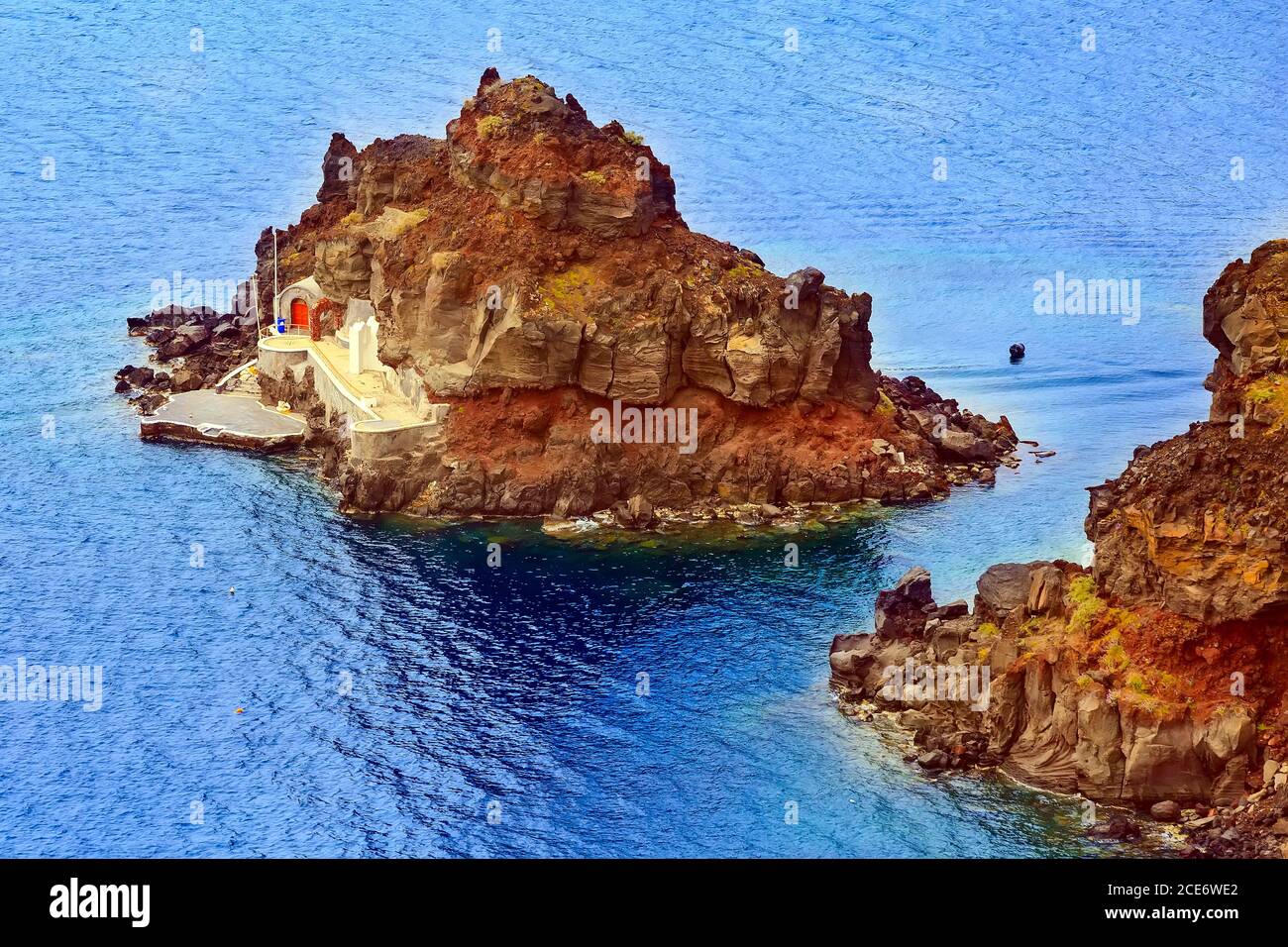 Small volcanic island in Santorini, Greece Stock Photo - Alamy
