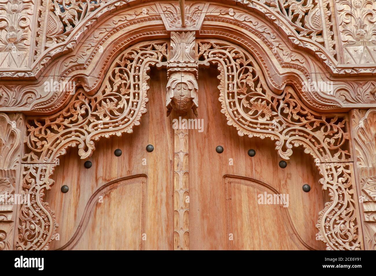 Balinese wood carved doors with traditional local ornaments. Local ...