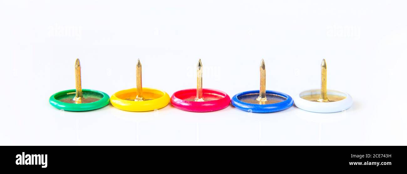 colorful thumbtack or pushpin in a row on white background Stock Photo ...