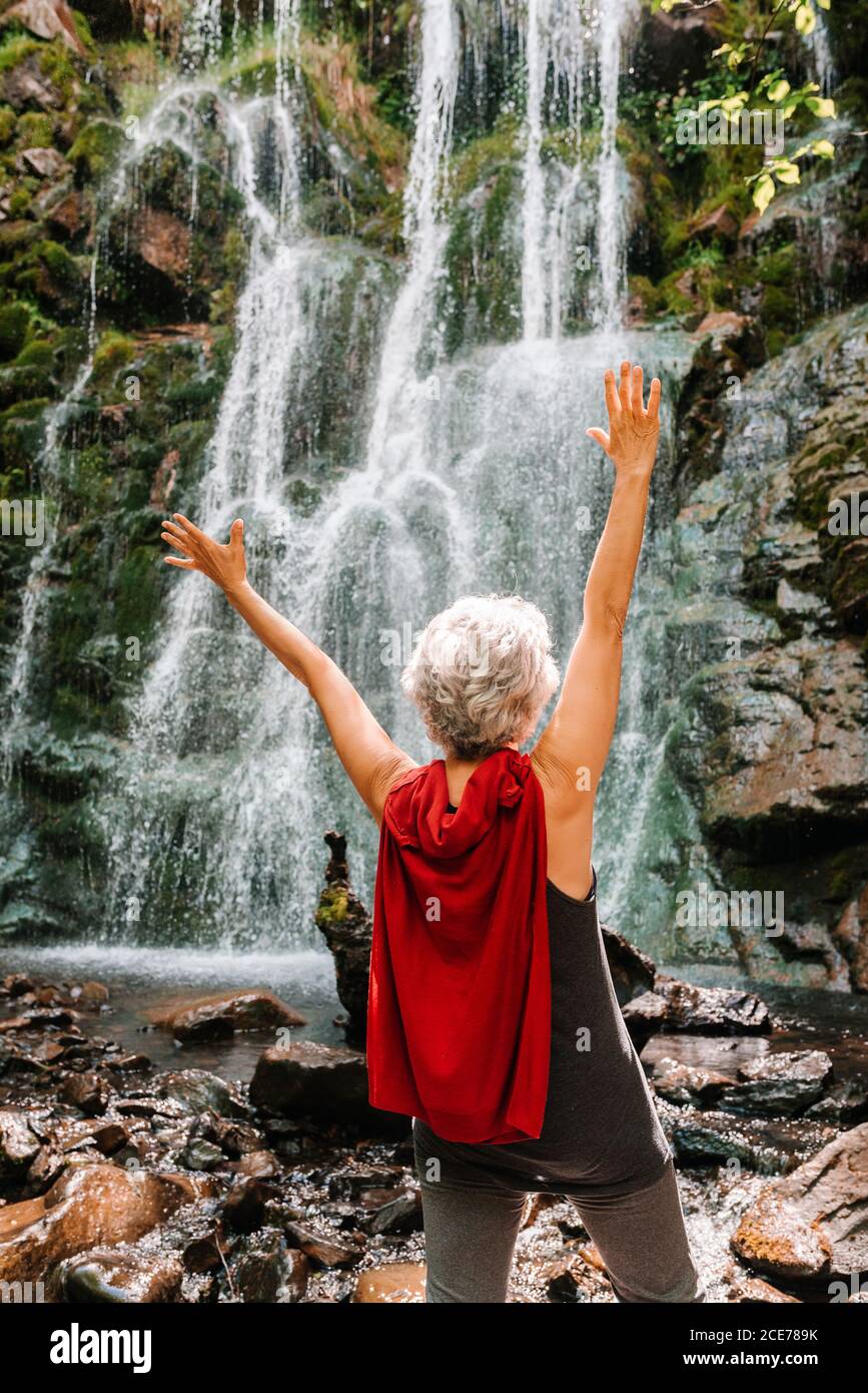 Back view of unrecognizable female tourist admiring majestic scenery of ...