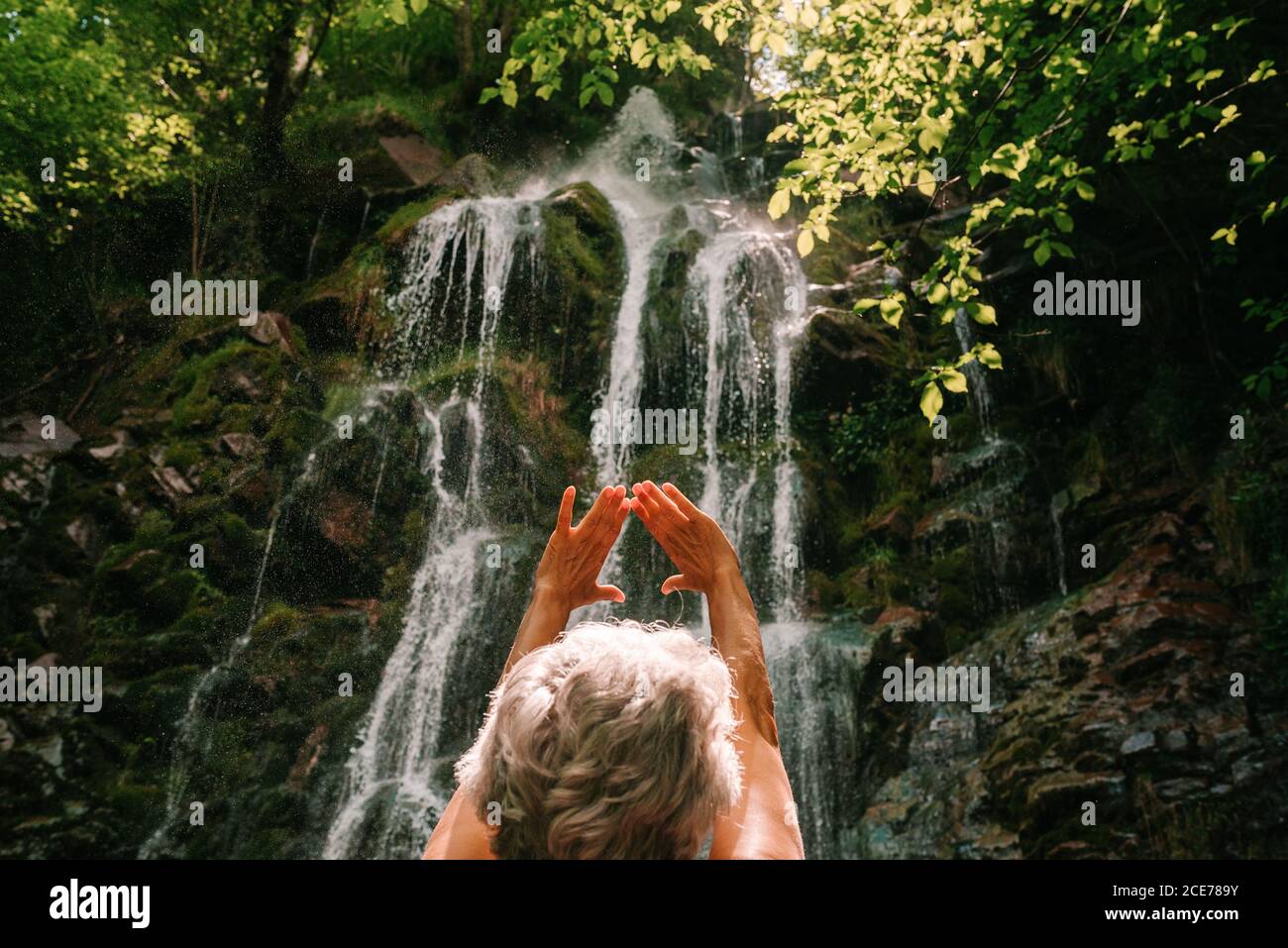 Back view of unrecognizable female tourist admiring majestic scenery of ...