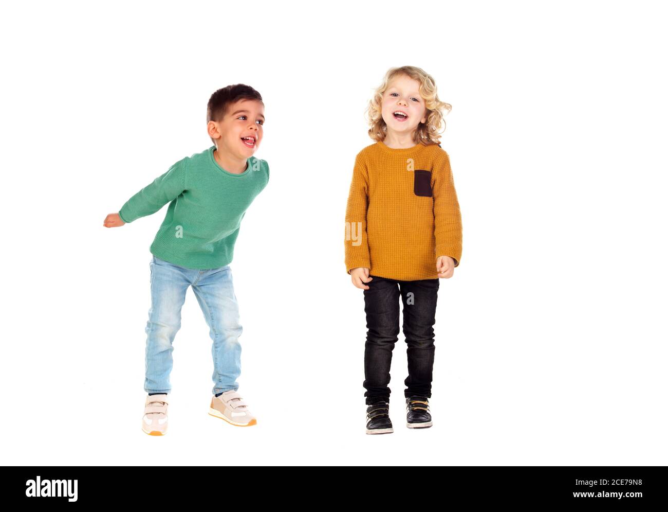 Full portrait of two children playing and laughing isolated on a white ...
