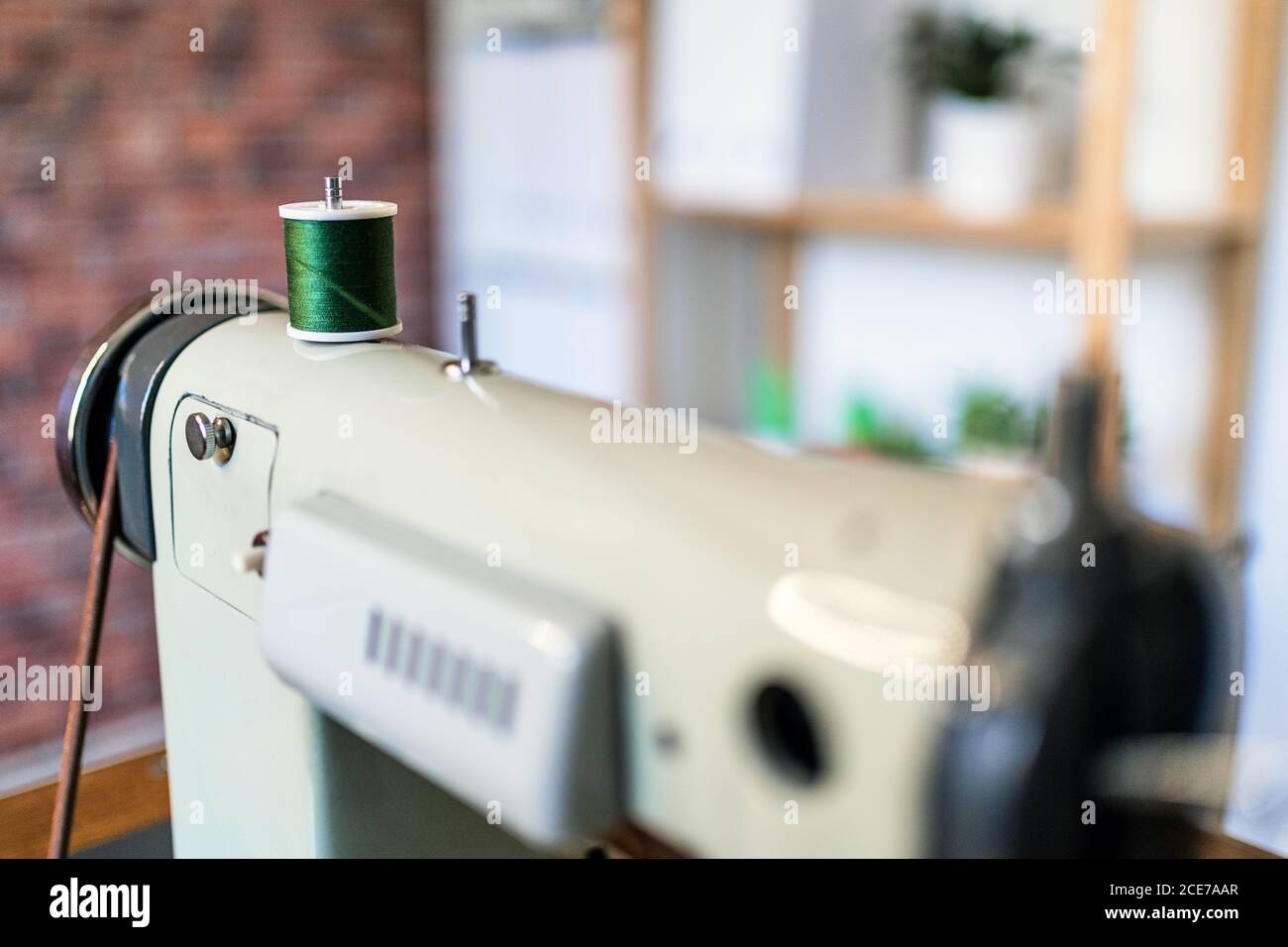 Composition of professional metal sewing machine and square textile for ...