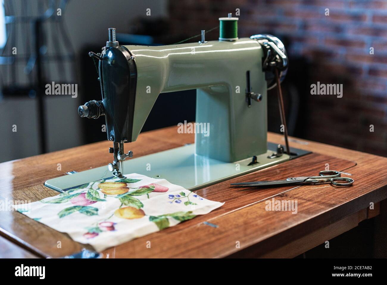 composition of professional metal sewing machine and square textile for ...