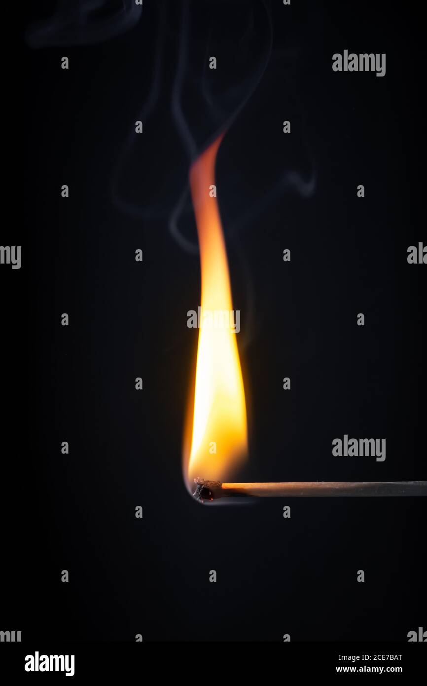 match flame dark background Stock Photo - Alamy