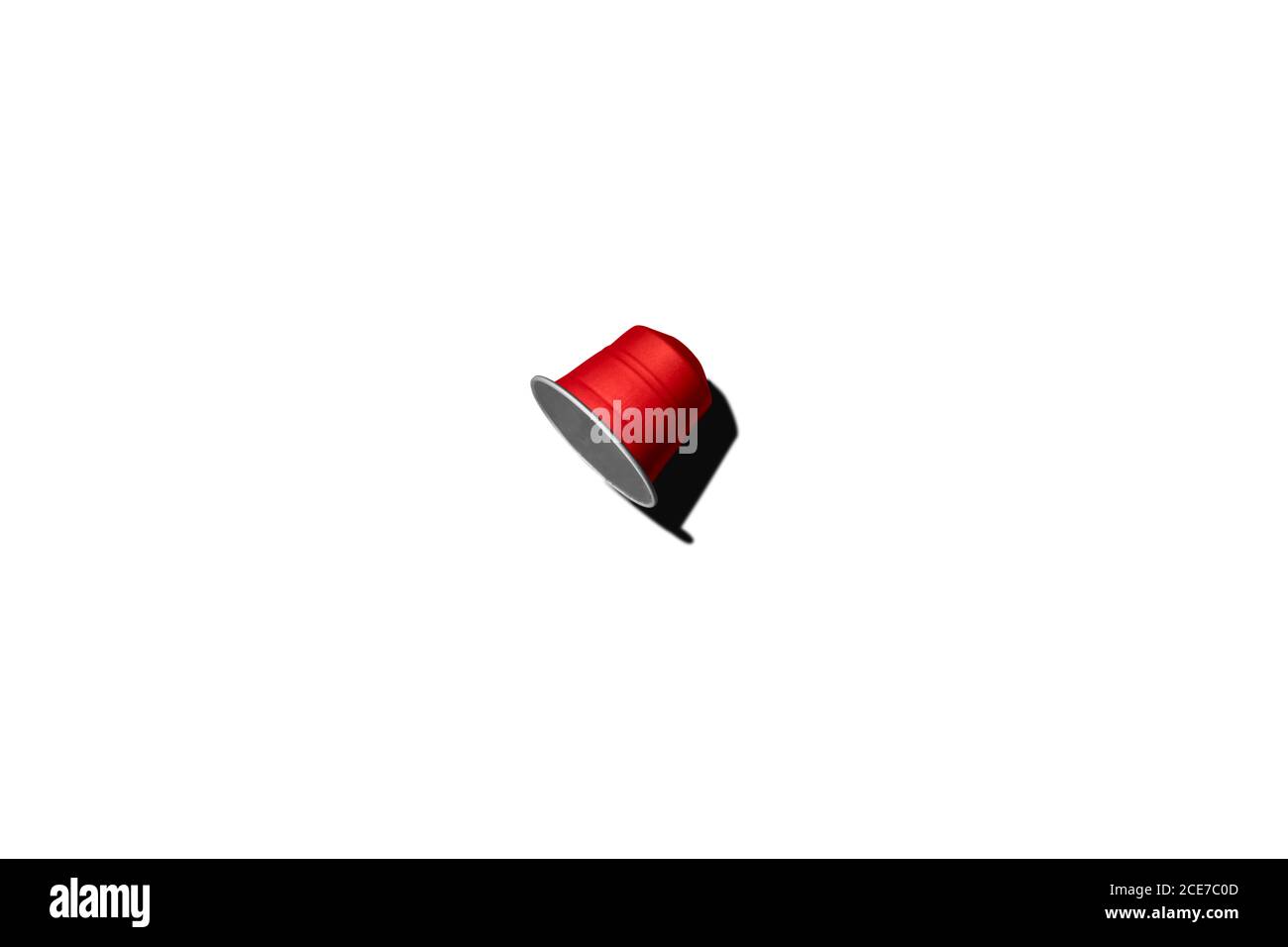Top view of red coffee pod placed on white background Stock Photo - Alamy