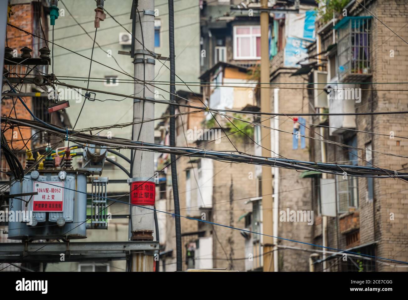 Mess of electric cables and telephone wires hi-res stock photography ...