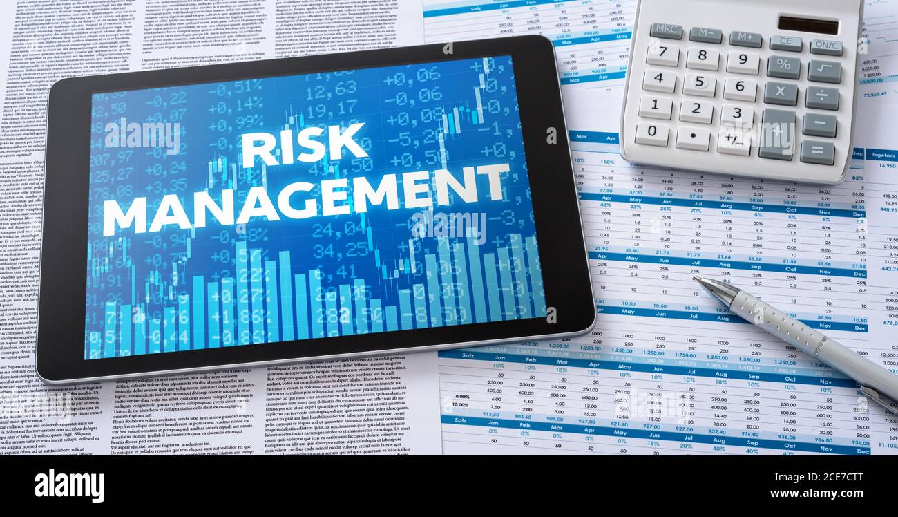 A tablet with financial documents - Risk Management Stock Photo - Alamy