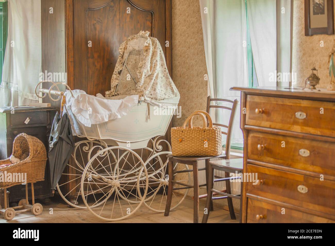 White vintage pram in an old room Stock Photo - Alamy