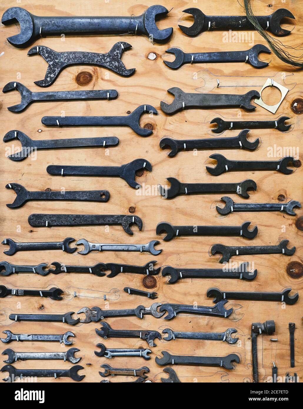 Set of different nut wrenches on brown board in studio Stock Photo - Alamy