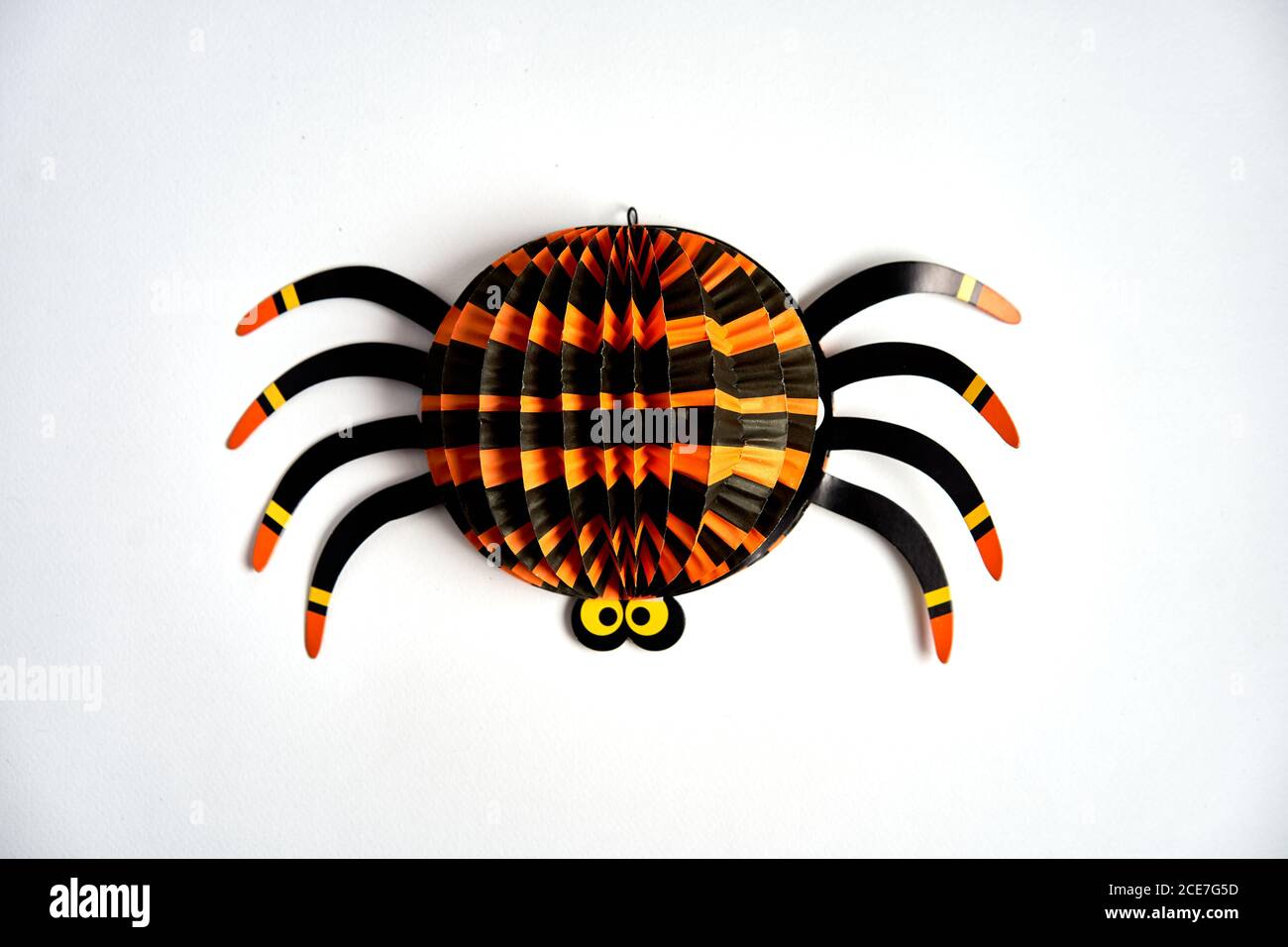 Halloween spider orange black paper craft white background isolated ...