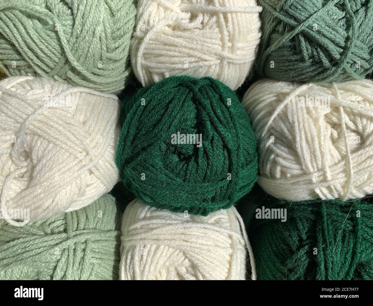 Closeup shot of white and green knitting wool threads Stock Photo - Alamy
