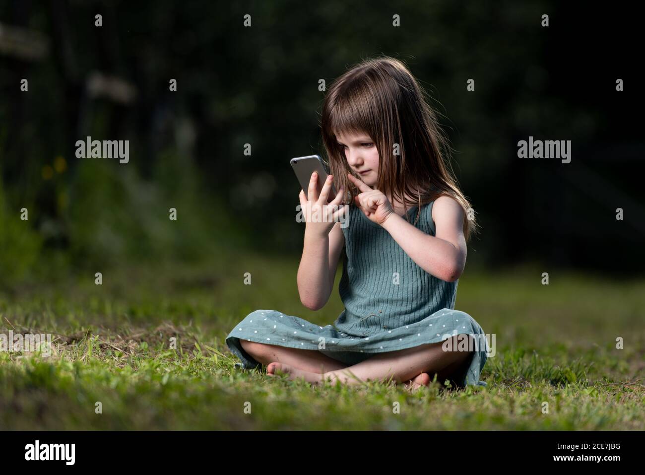 Child legs crossed hi-res stock photography and images - Alamy