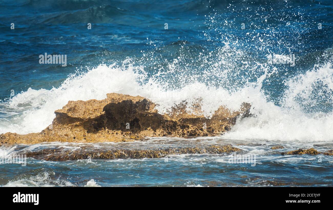 ocean rough rock water splash background Stock Photo - Alamy