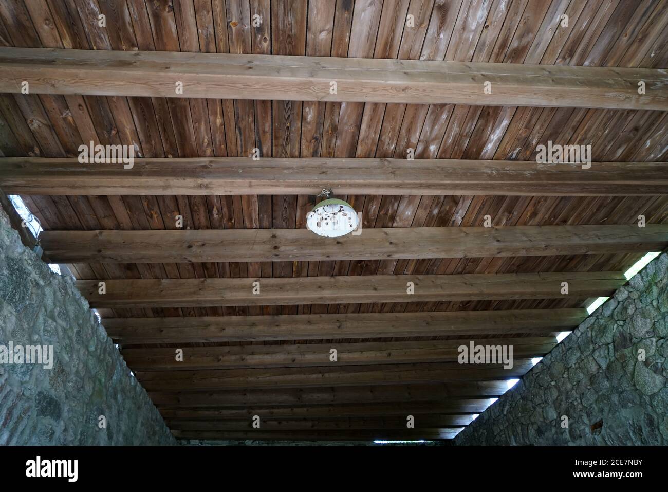 Low angle shot of an old lamp on wooden ceiling Stock Photo - Alamy