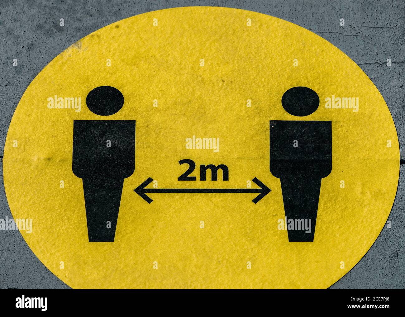 Keep two metre distance due to Covid-19 epidemic sign on floor Stock ...