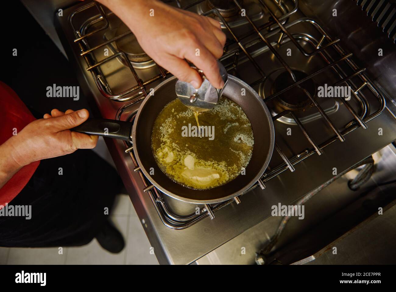 Pouring oil pan hi-res stock photography and images - Alamy