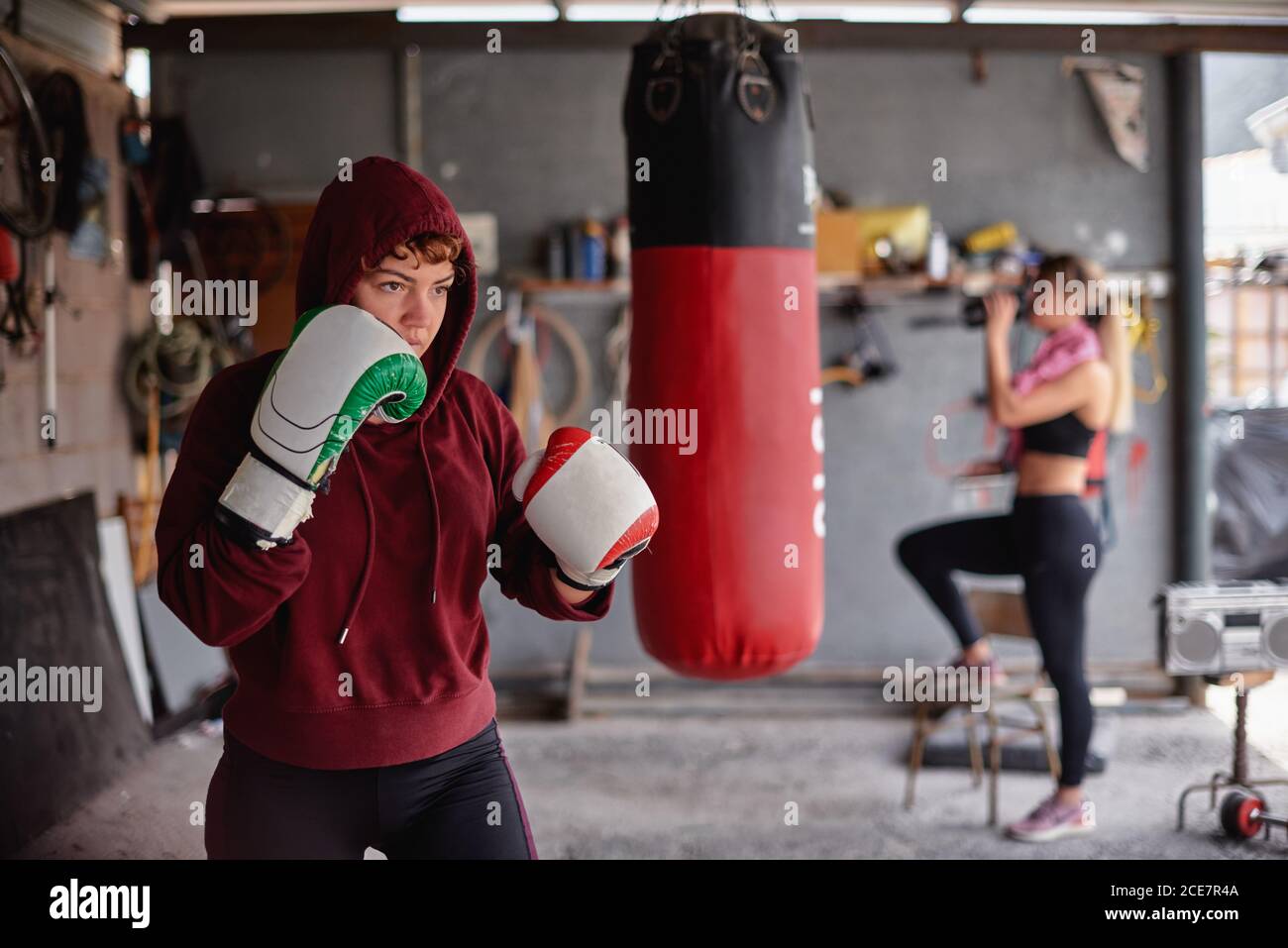 Determined sportsWoman shadow boxing in gym Stock Photo - Alamy