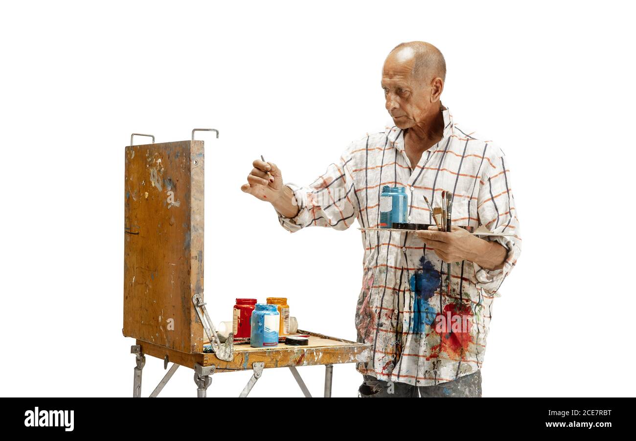 Male caucasian artist, painter at work isolated on white studio ...