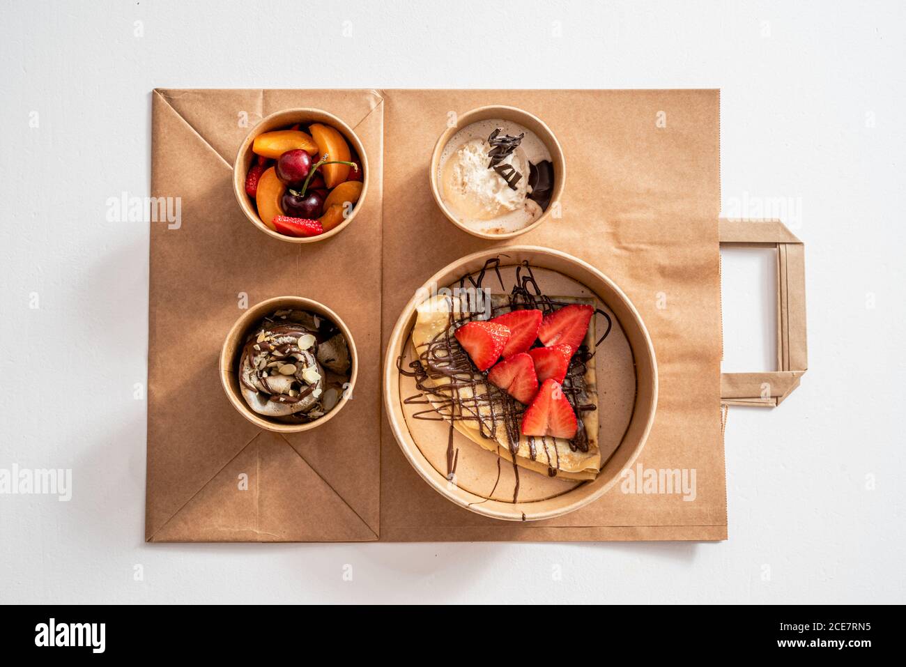 Top view of various ice creams decorated with chocolate and almond ...