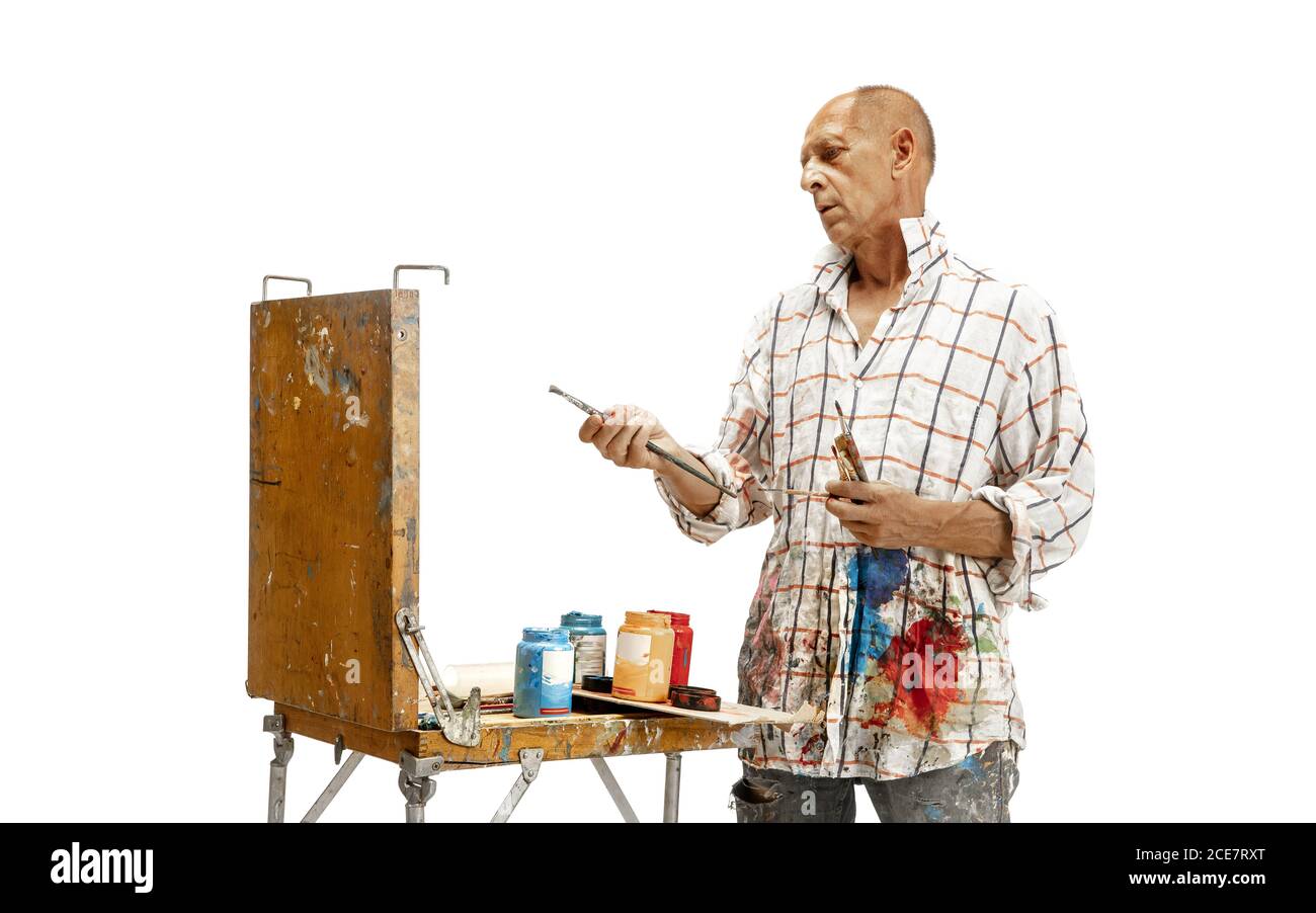 Male caucasian artist, painter at work isolated on white studio ...